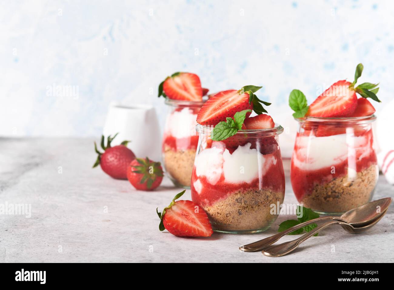 Strawberry Cheesecake. Cheesecake or trifle with strawberry in glass on ...