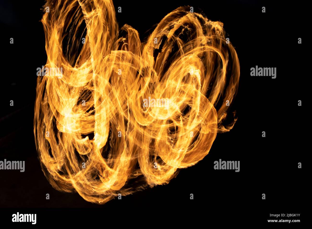 Lines of fire on black background. Flames in dark. Shoot torsion of ...