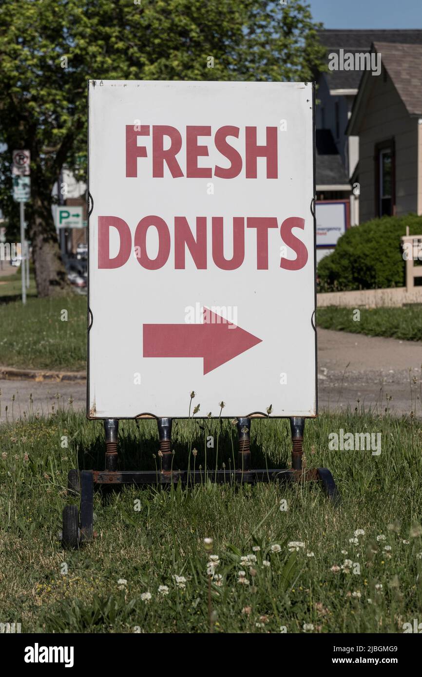 Fresh Donuts sign with an arrow - subtitled How To Catch a Cop Stock ...