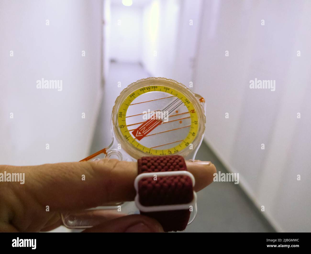 A compass in a person's hand. Orient yourself in the current situation ...