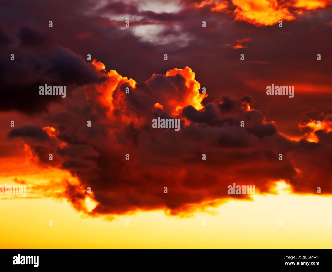 Shift of wind, ragged clouds. Sunset sky colors Stock Photo - Alamy