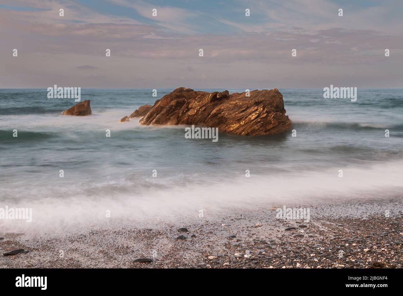 Long exposure image of waves breaking over rocks on the North Cornish ...