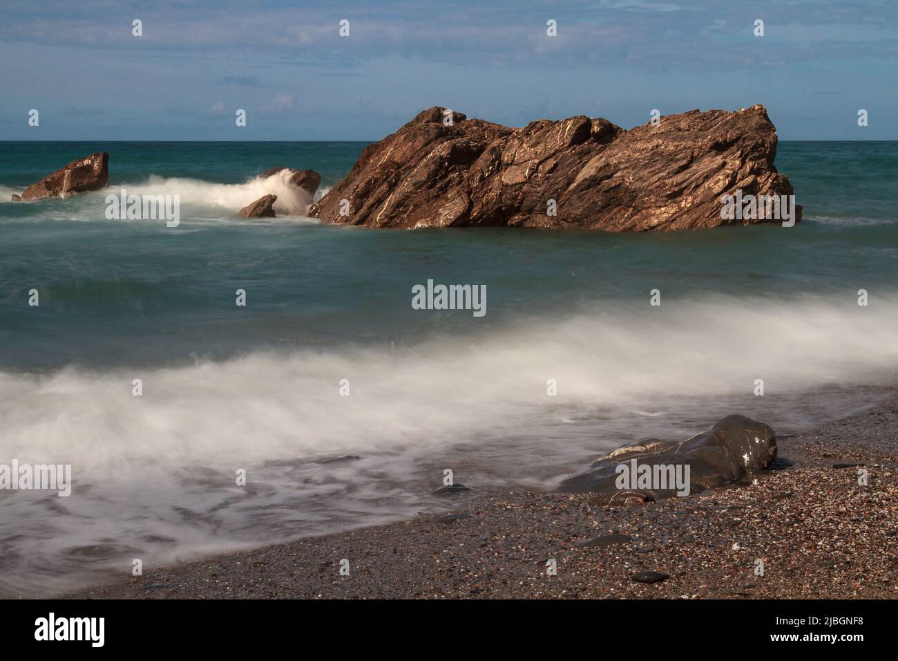 Long exposure image of waves breaking over rocks on the North Cornish ...