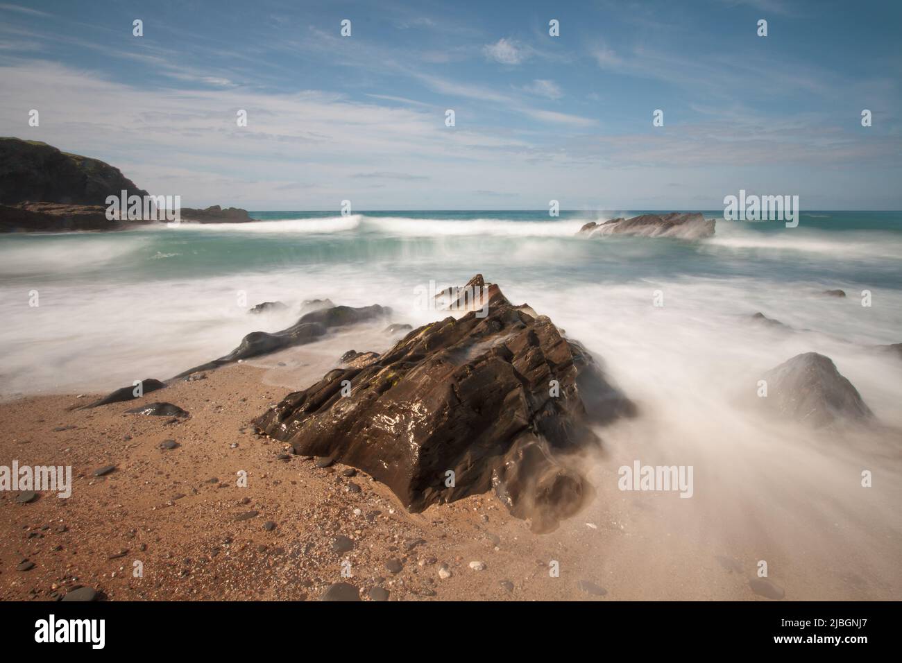 Long exposure image of waves breaking over rocks on the North Cornish ...