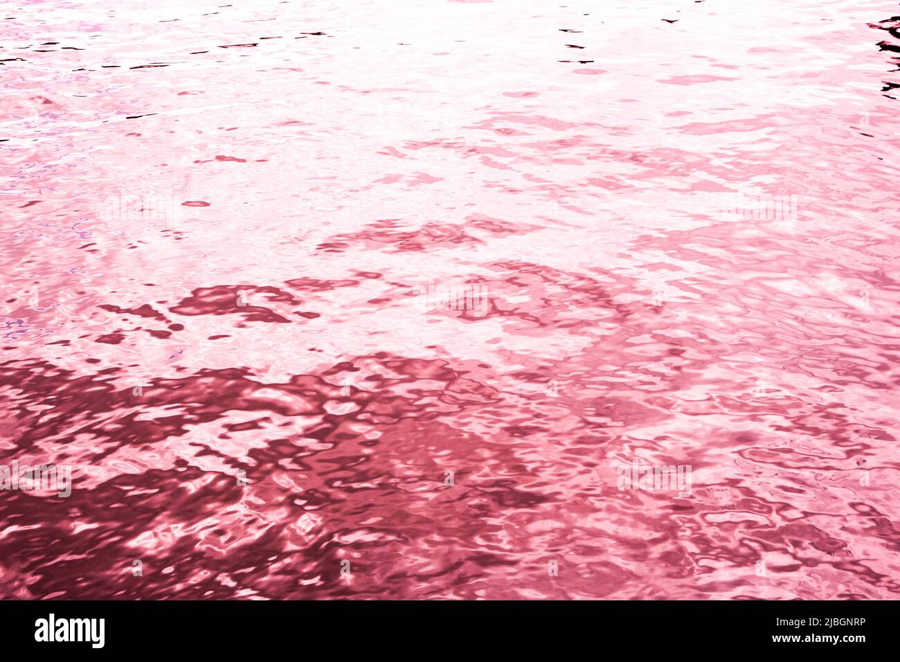 Abstract deep red coloured water surface background with vibrant Stock ...