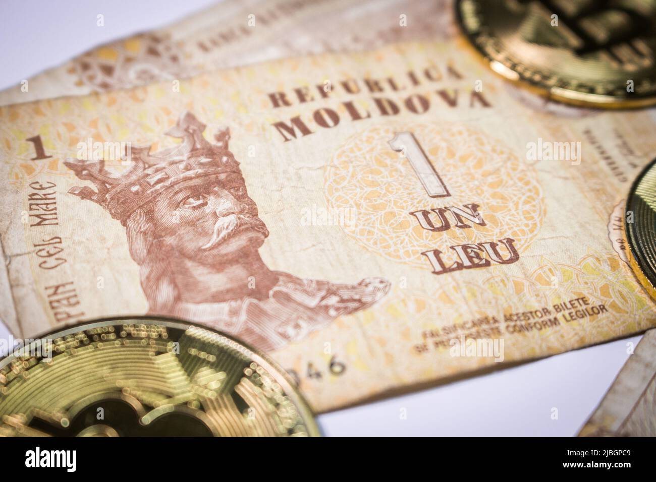 Close up of notes of Moldovan leu (mdl) with bitcoins on white ...