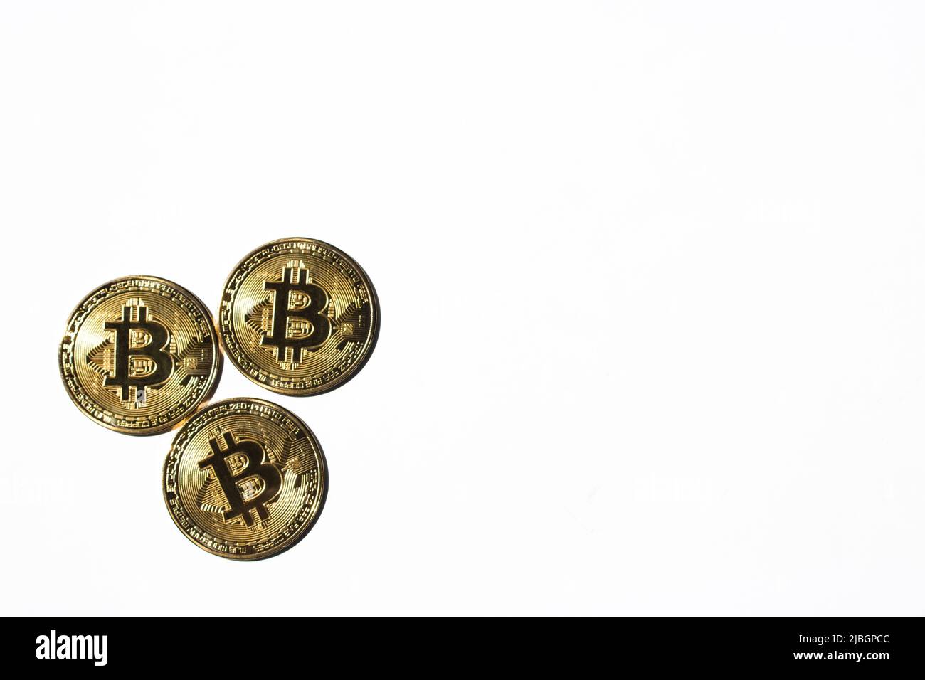 Three Bitcoins with copy space in white background Stock Photo - Alamy