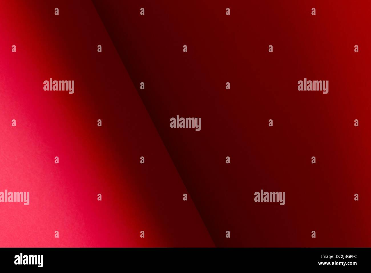 Abstract red folded colored paper background Stock Photo - Alamy