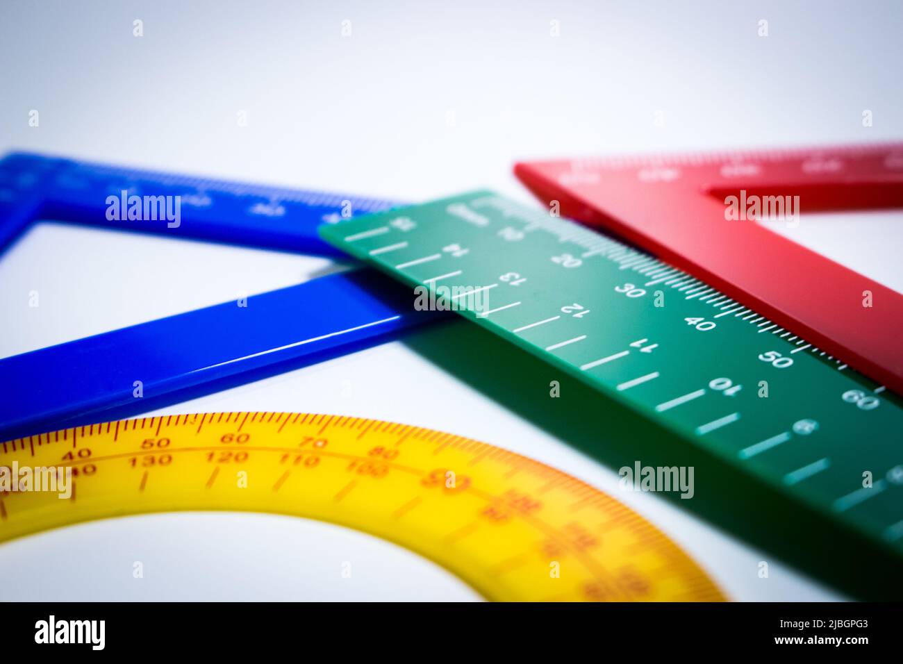 Concept image of colourful rulers and protractor in white background ...