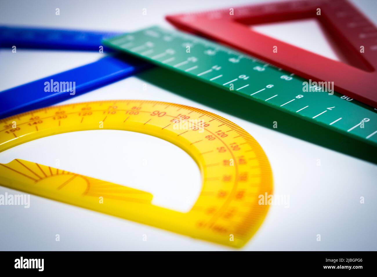 Concept image of colourful rulers and protractor in white background ...