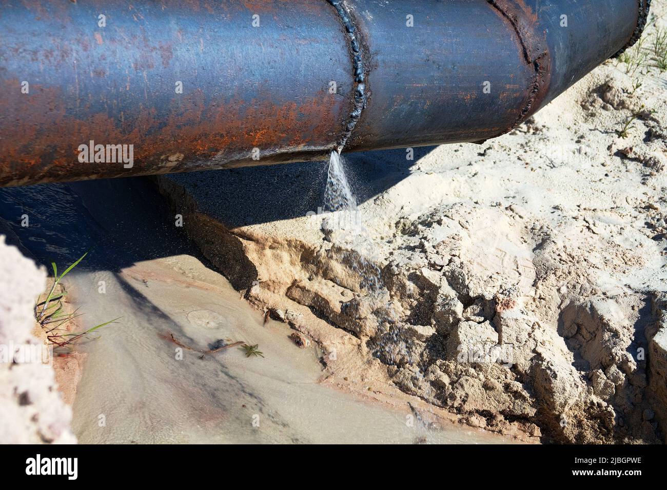 The water broke through an iron water pipe (busted water main). Lack of ...