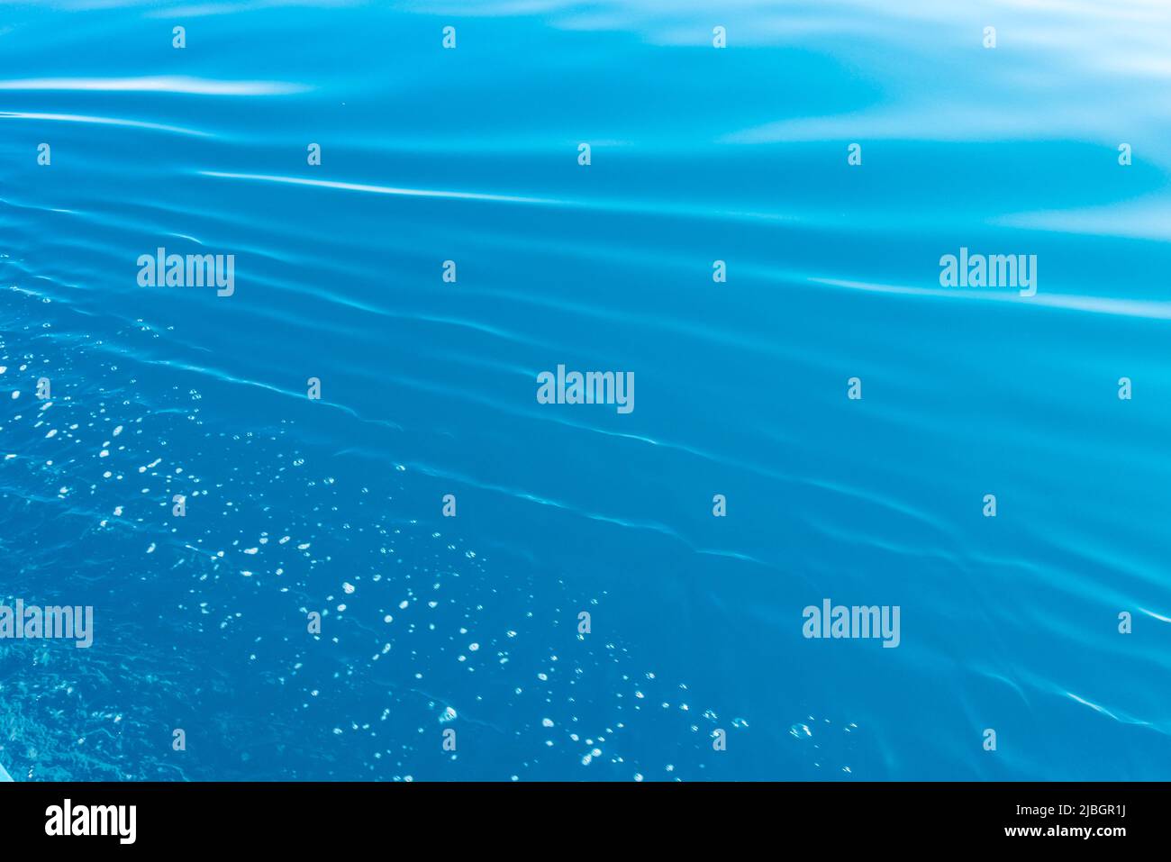 Clear water texture in blue and orange. Background of the ocean and the ...