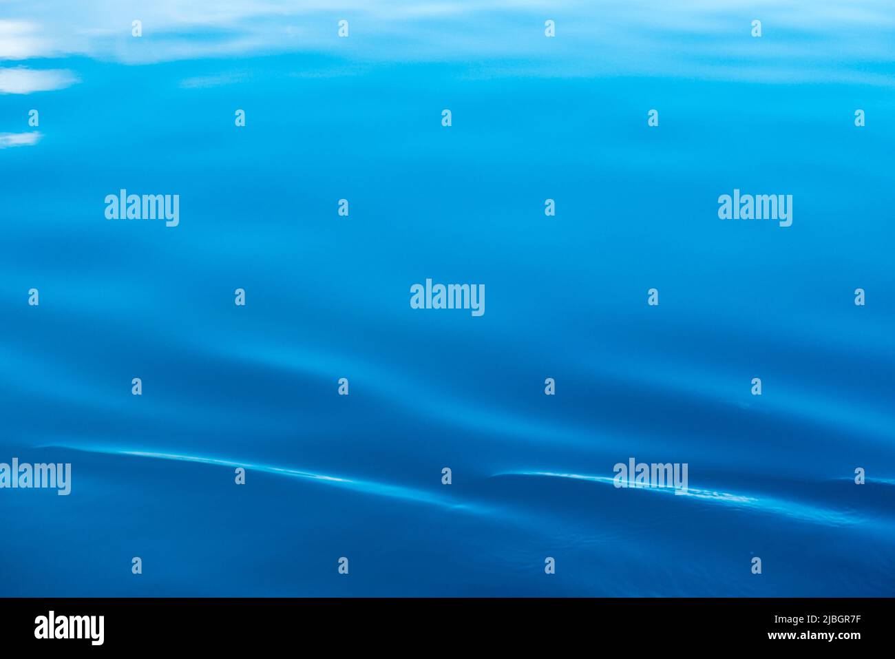 Clear water texture in blue and orange. Background of the ocean and the ...
