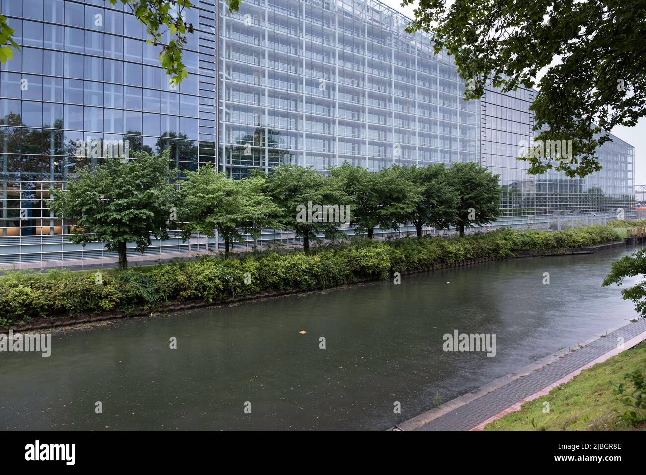 Glass facade of the Louise Weiss building of the European Parliament in ...