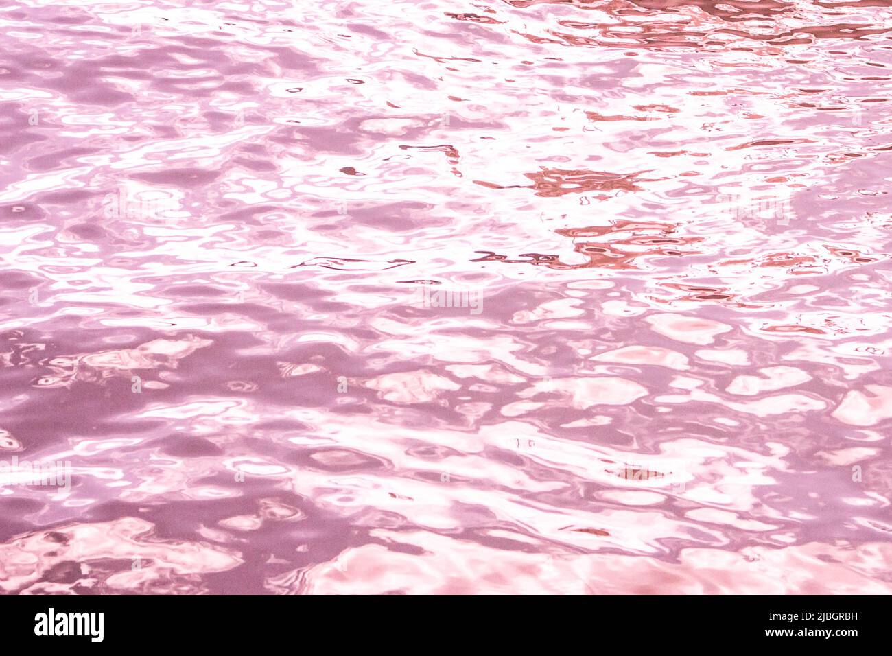 Abstract deep red coloured water surface background with vibrant Stock ...