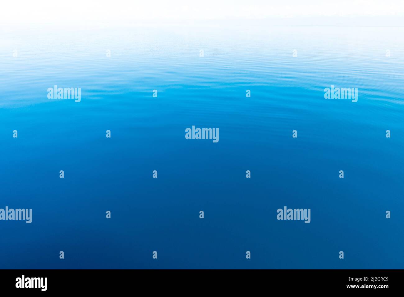 Clear water texture in blue and orange. Background of the ocean and the ...