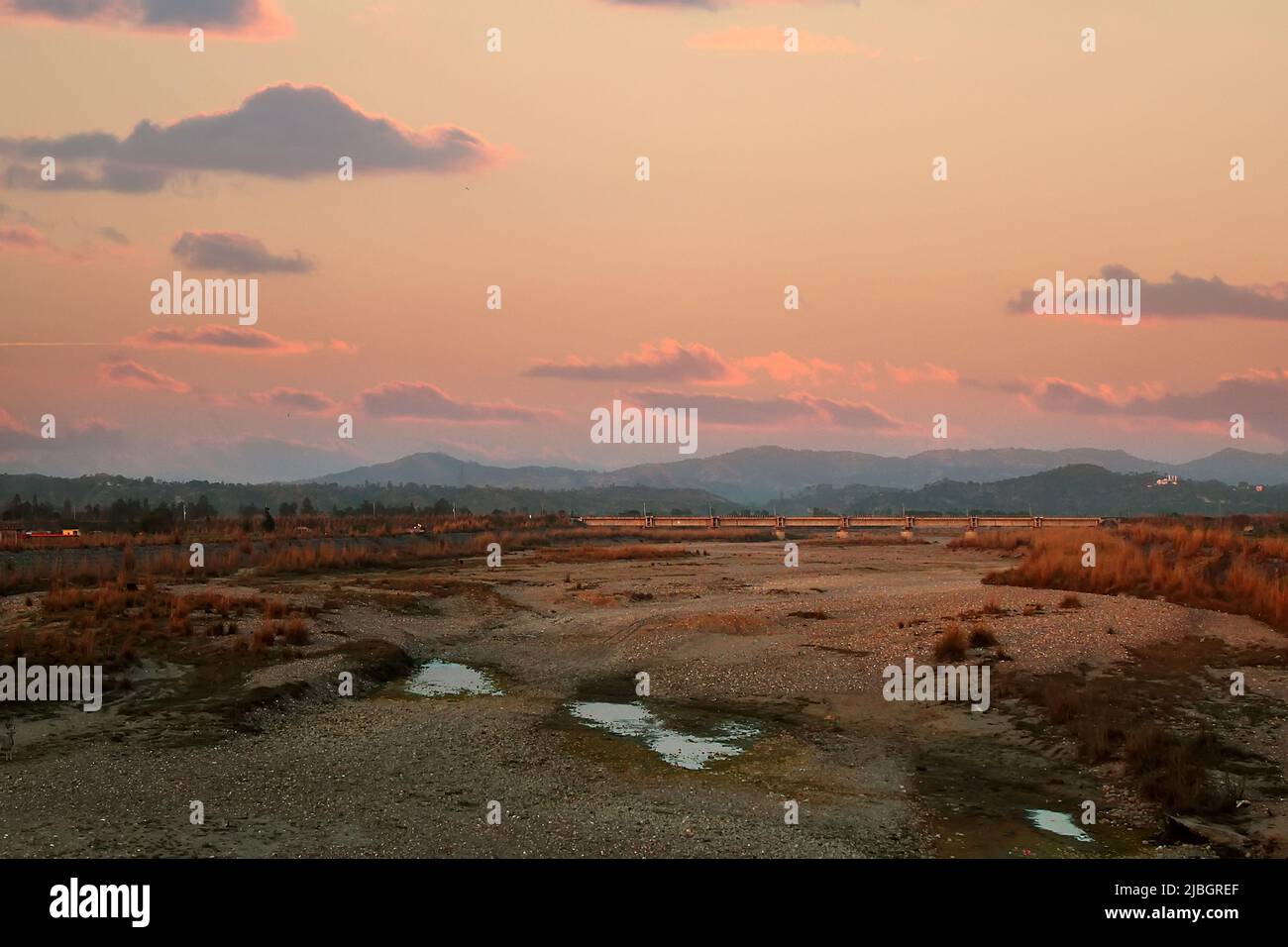 Wadi. The riverbed during the winter low water. Mountains at a ...