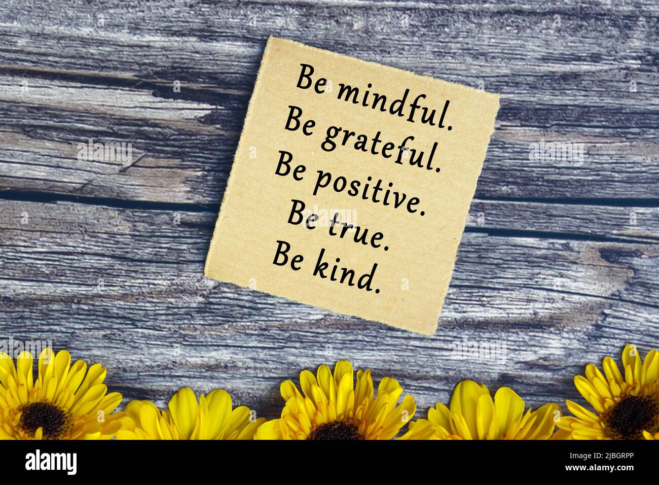 Motivational quote on torn brown paper - Be mindful, grateful, positive ...