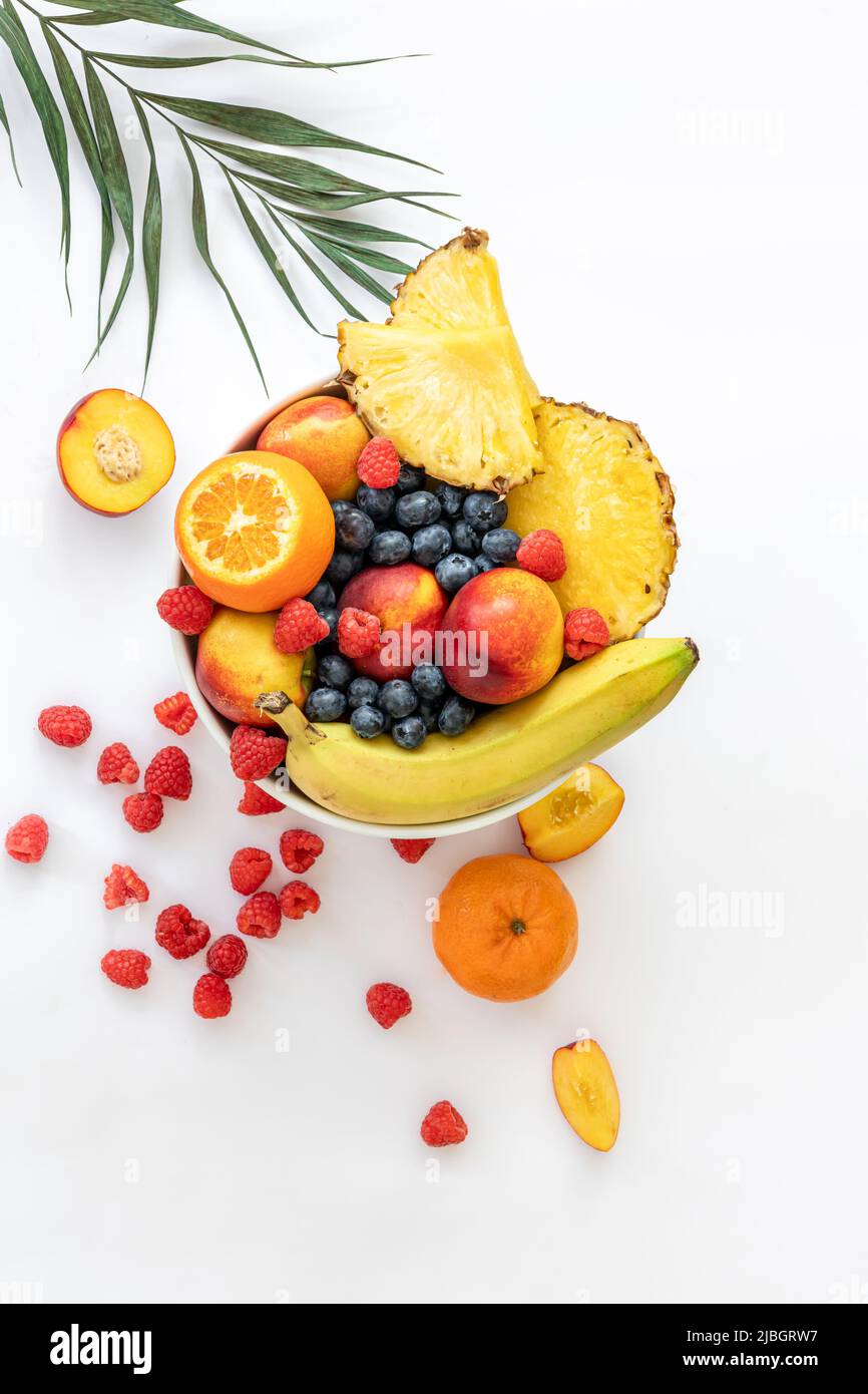 Tropical fruits on a white background top view Stock Photo - Alamy