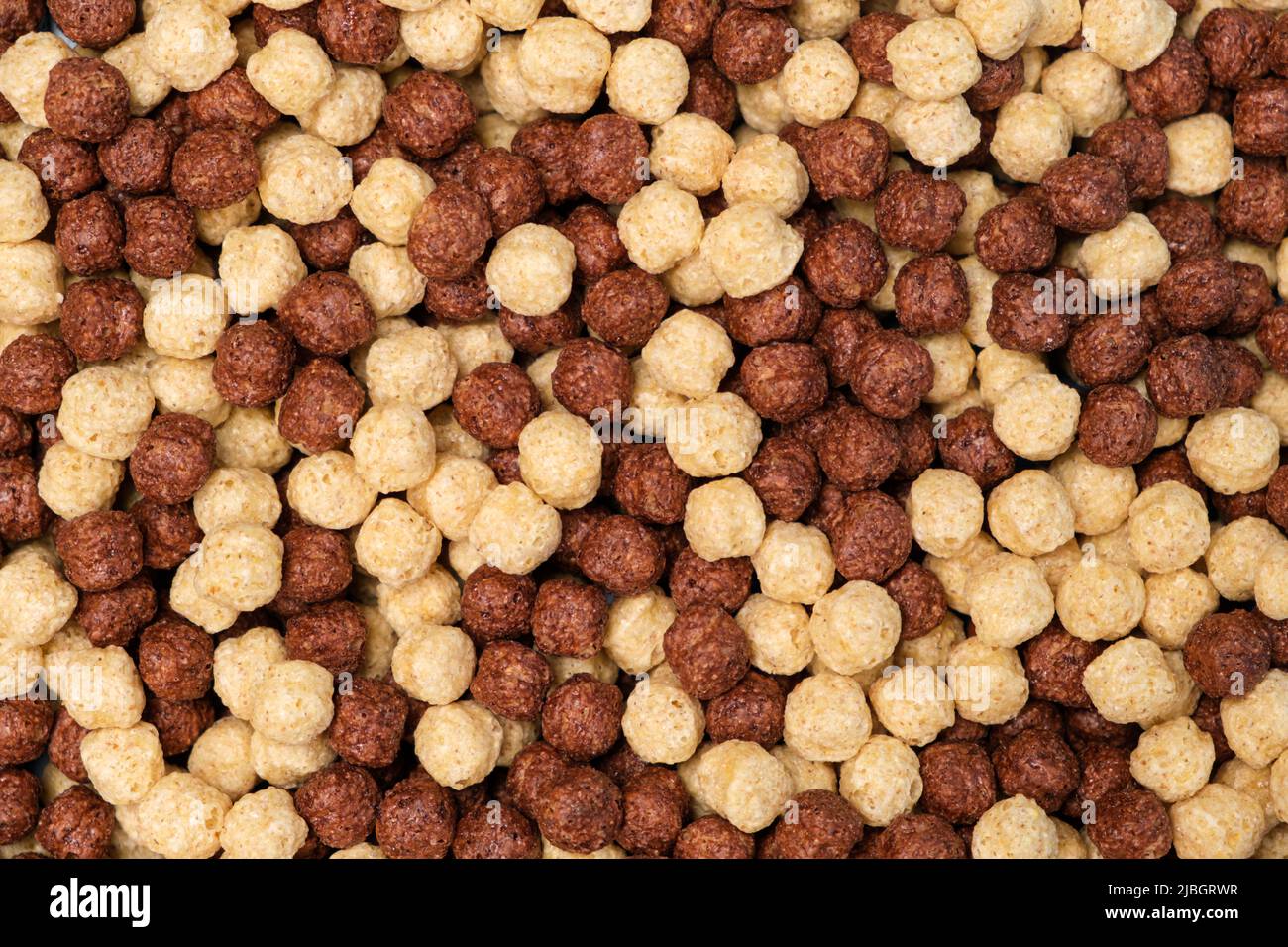 Breakfast cereal - corn and wheat balls with cocoa on a blue background ...