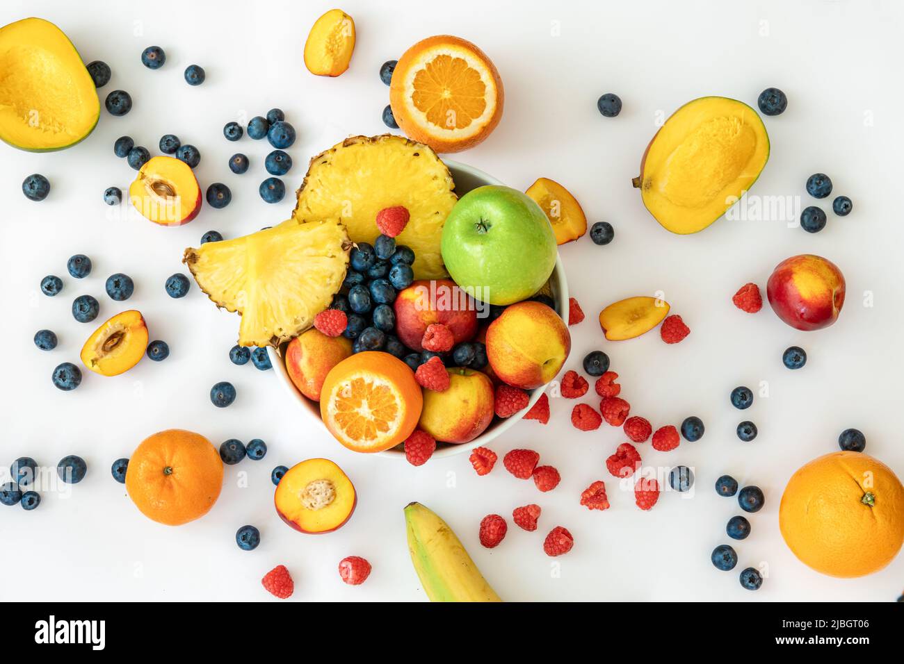 Tropical fruits on a white background top view Stock Photo - Alamy