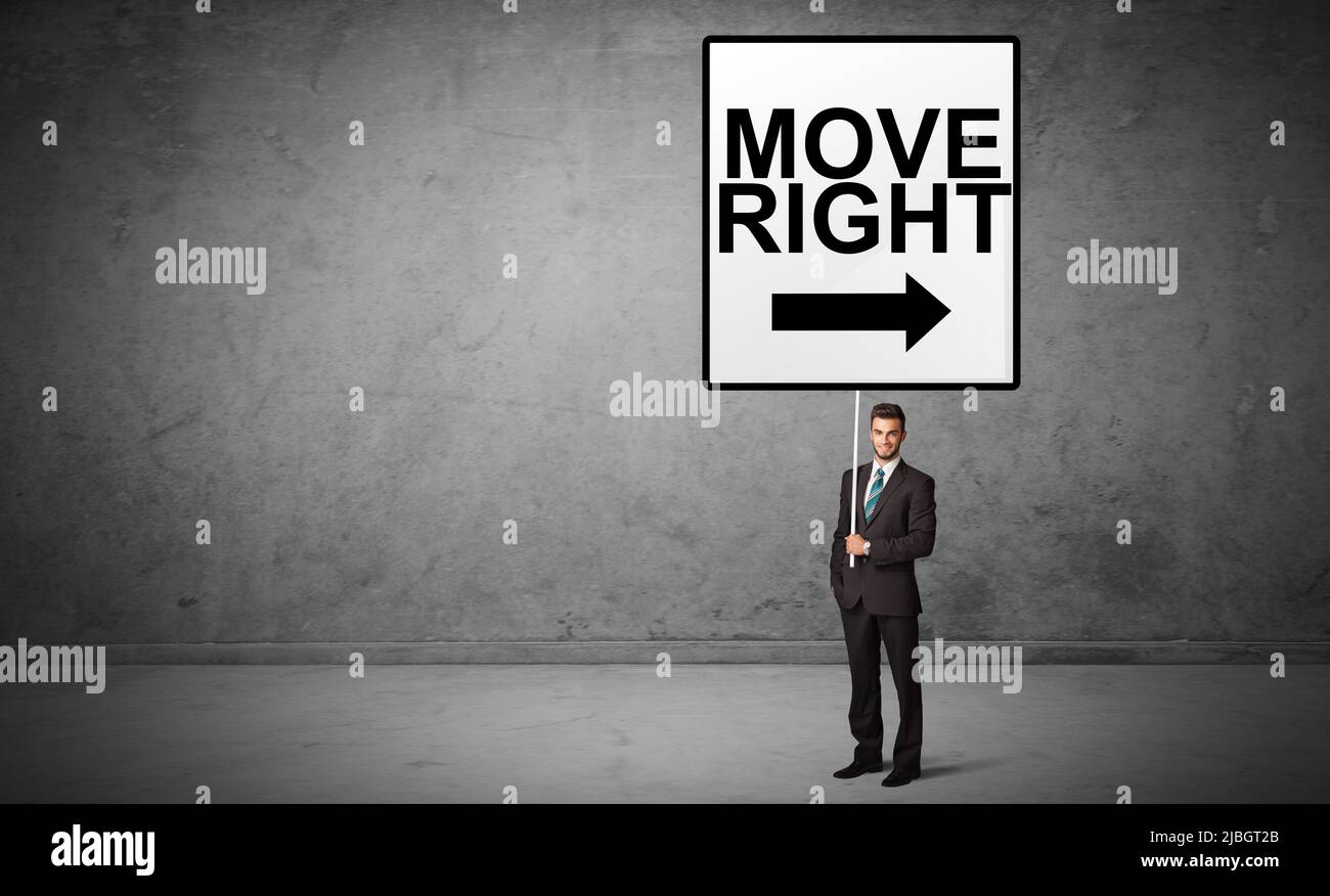 business person holding a traffic sign Stock Photo - Alamy