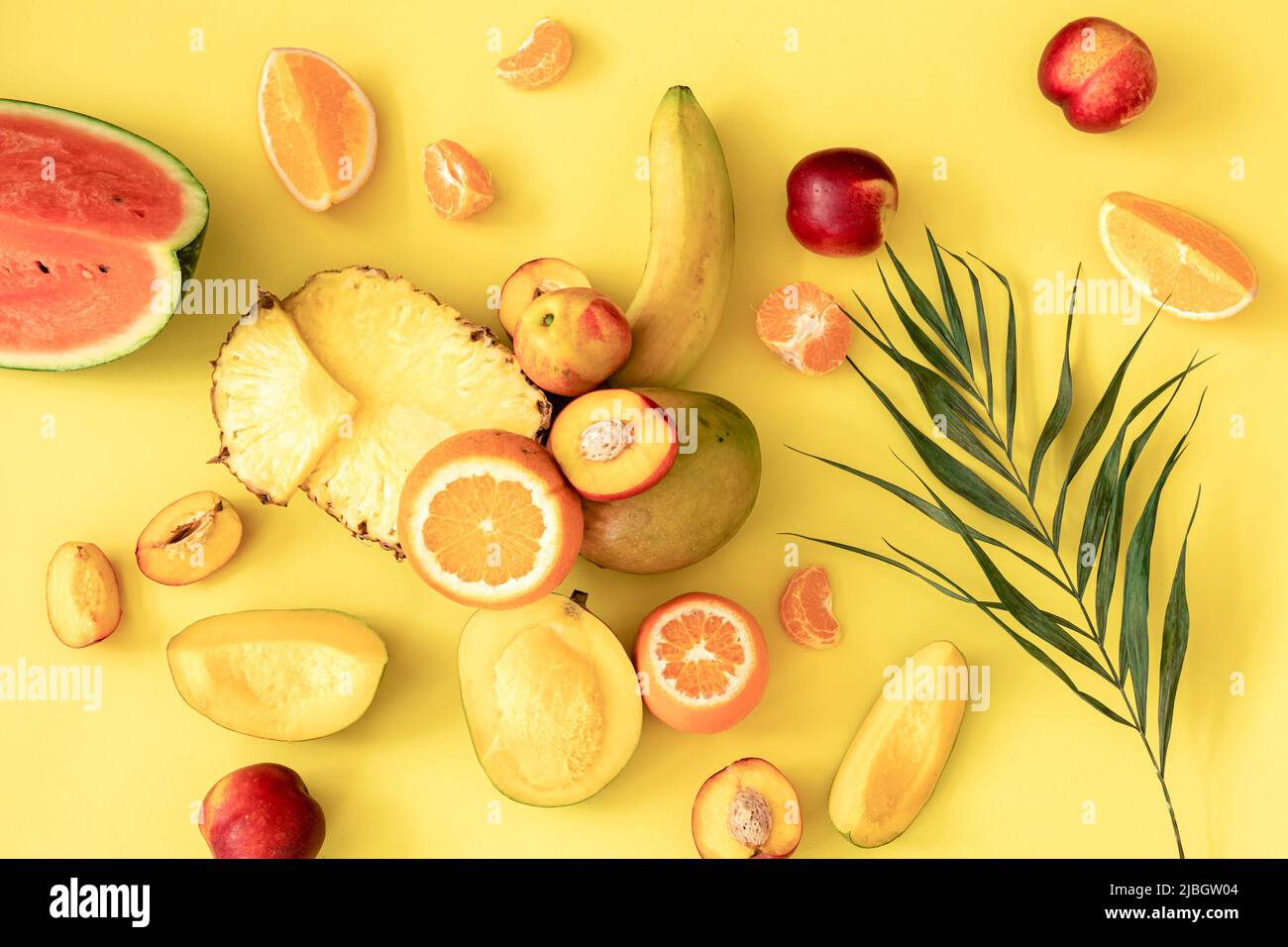 Tropical fruits and berries on a yellow background, flat lay Stock ...
