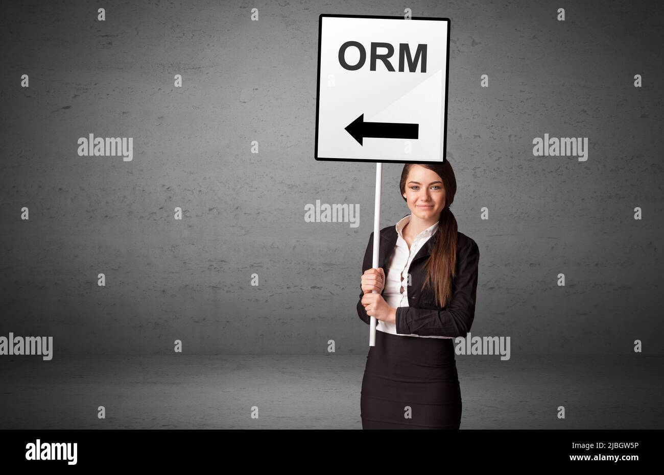 business person holding a traffic sign Stock Photo - Alamy