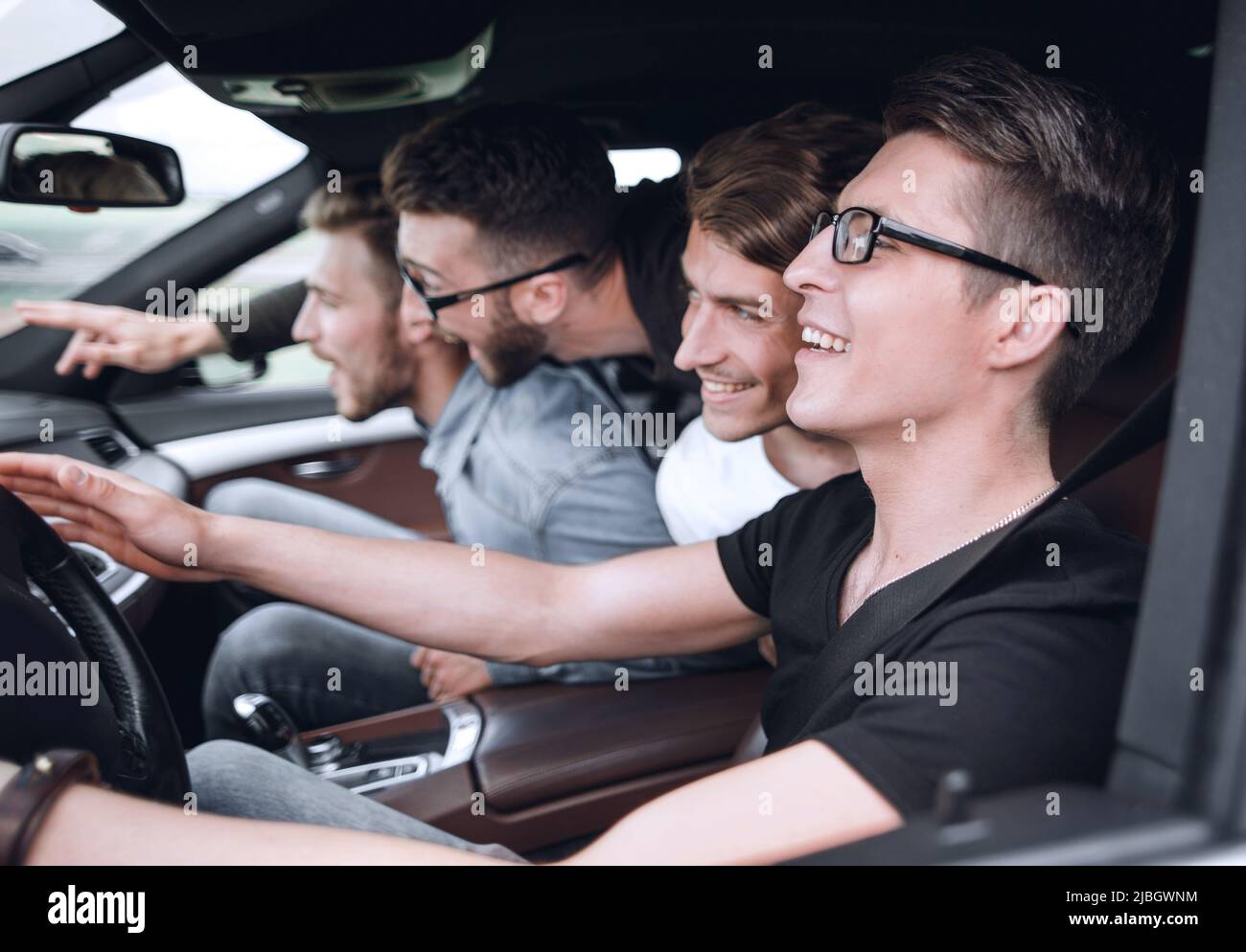 A young man rides in a car at high speed Stock Photo - Alamy