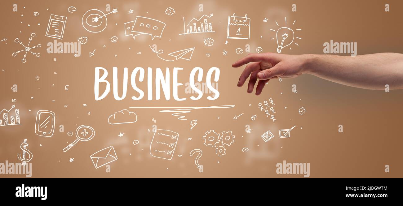 Close-Up of cropped hand pointing at business inscription Stock Photo ...