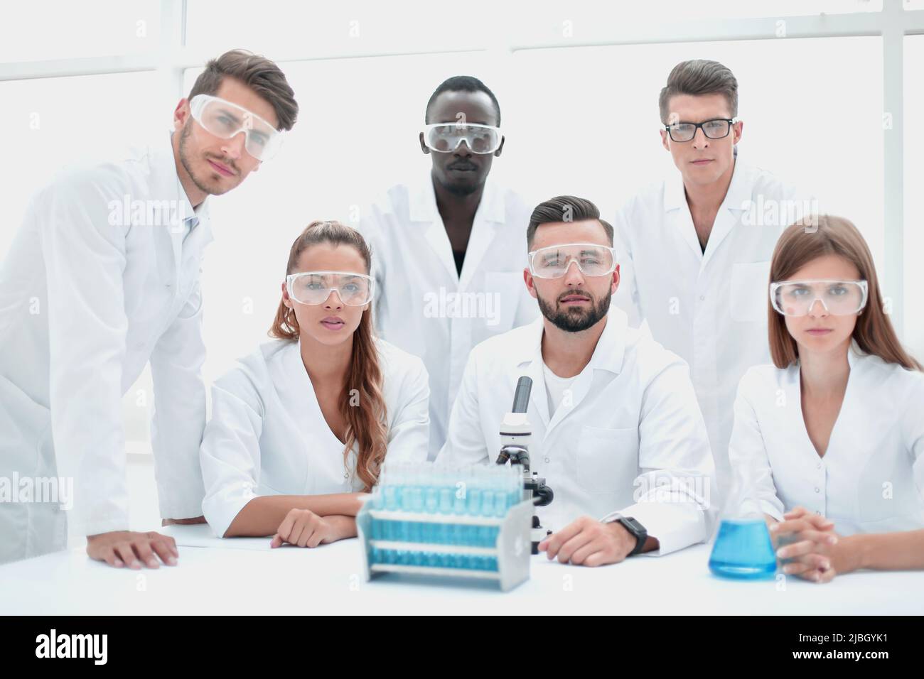 Group of scientists with gowns in laboratory Stock Photo - Alamy