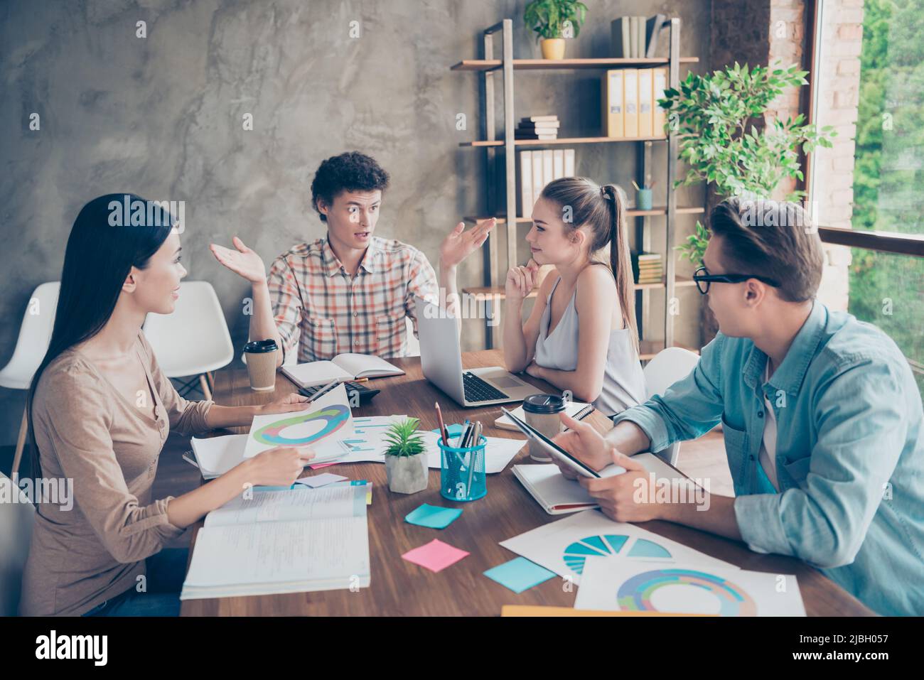 Photo of intelligent smart university students learning do homework at ...