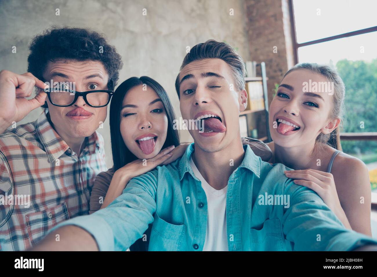Picture of good mood fooling around people two men and two women make ...