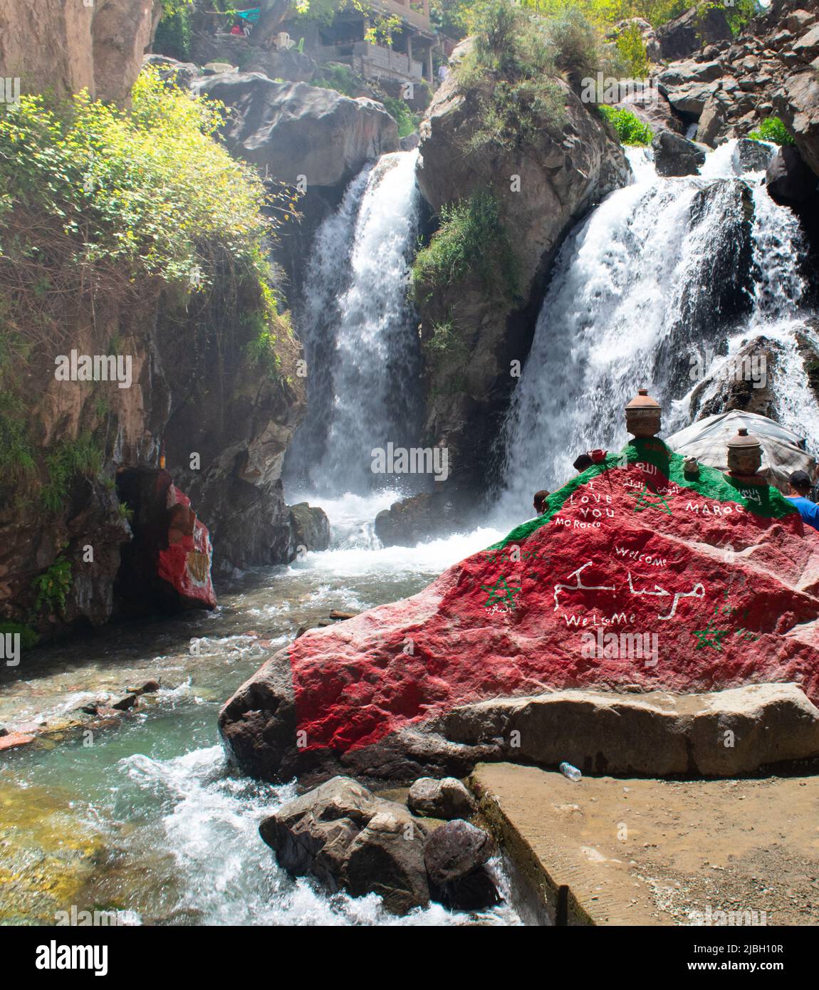 Marrakesh waterfall tourist destination with welcome writting mountain ...