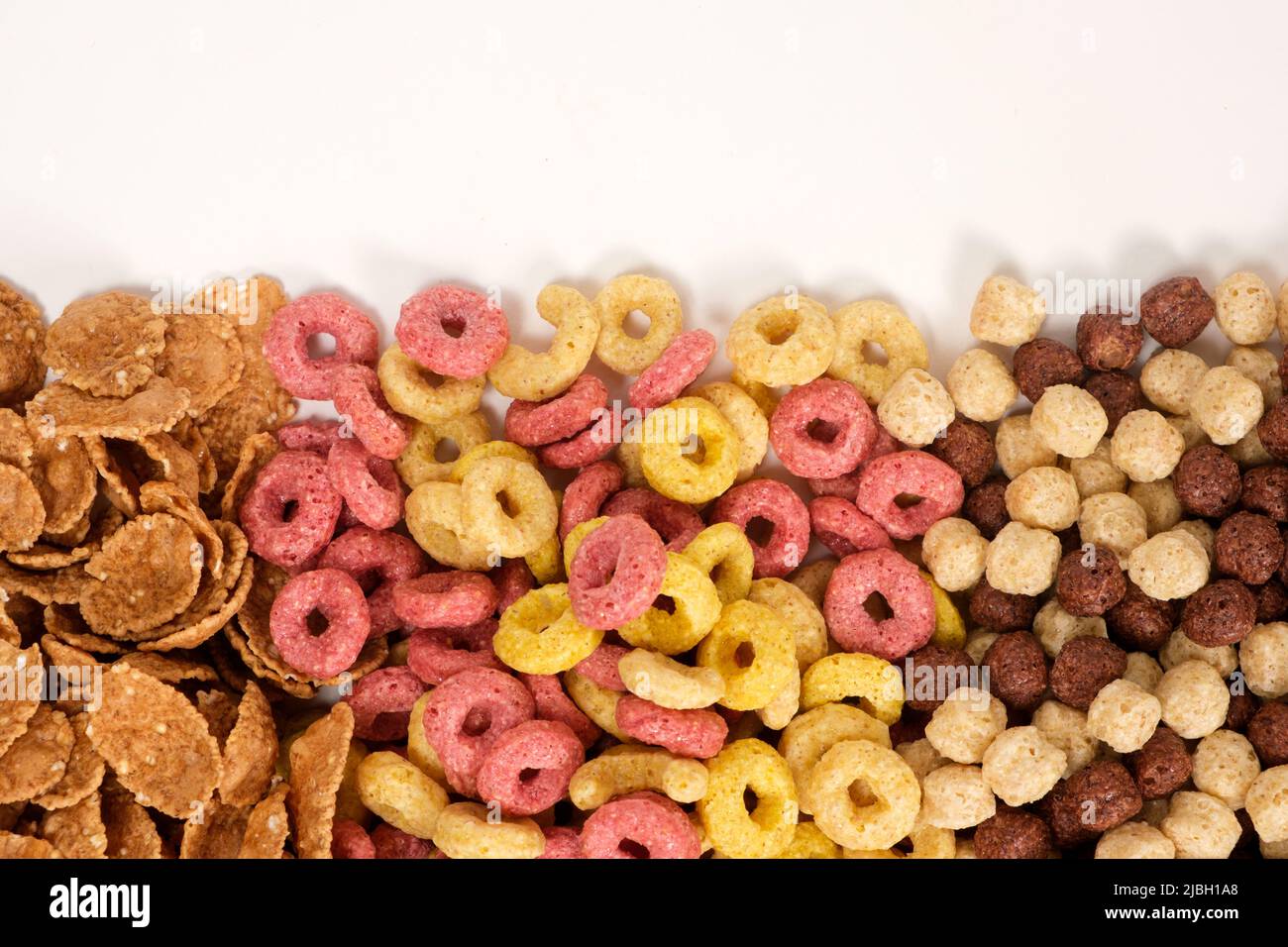 A set of different quick breakfast cereals - rings and balls, top view ...