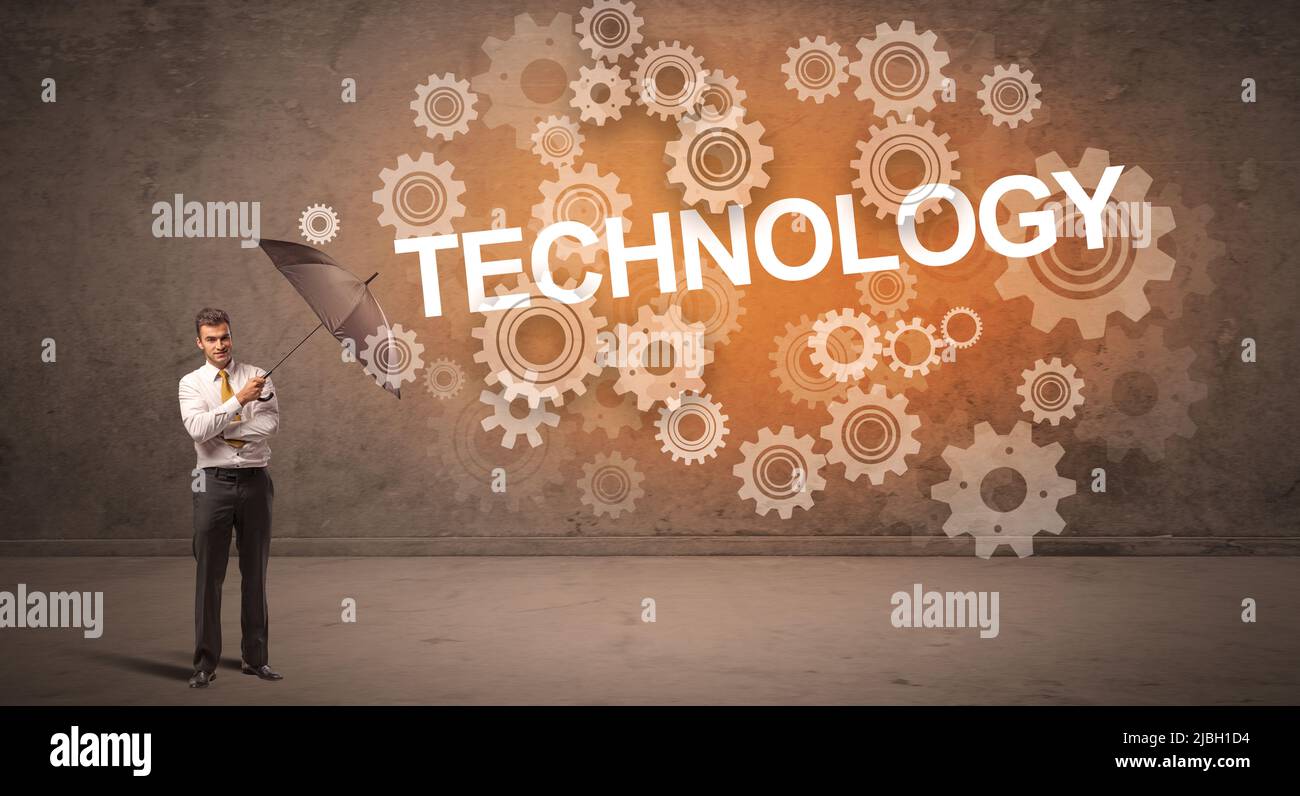 Businessman defending with umbrella concept Stock Photo - Alamy