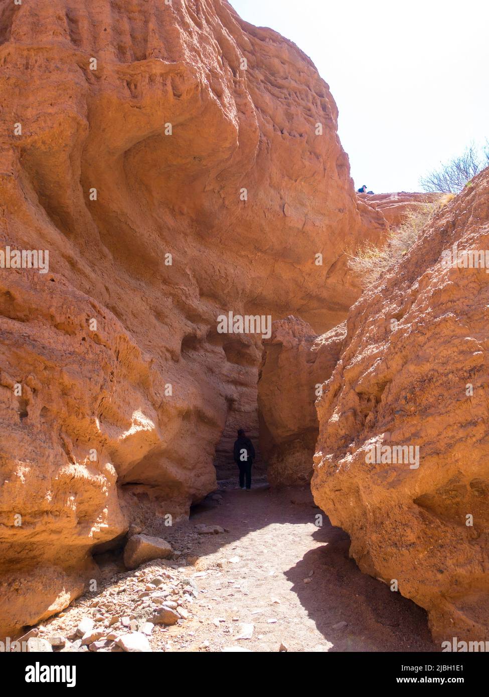 Red rocks and a passage between rocks. Clay canyons. Issyk-Kul region ...