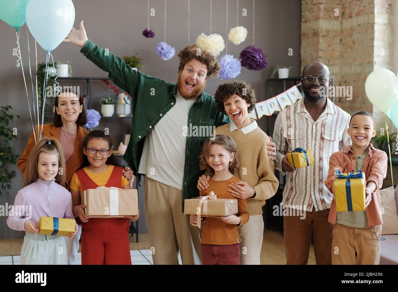 Portrait of excited parents and their happy friends with children ...