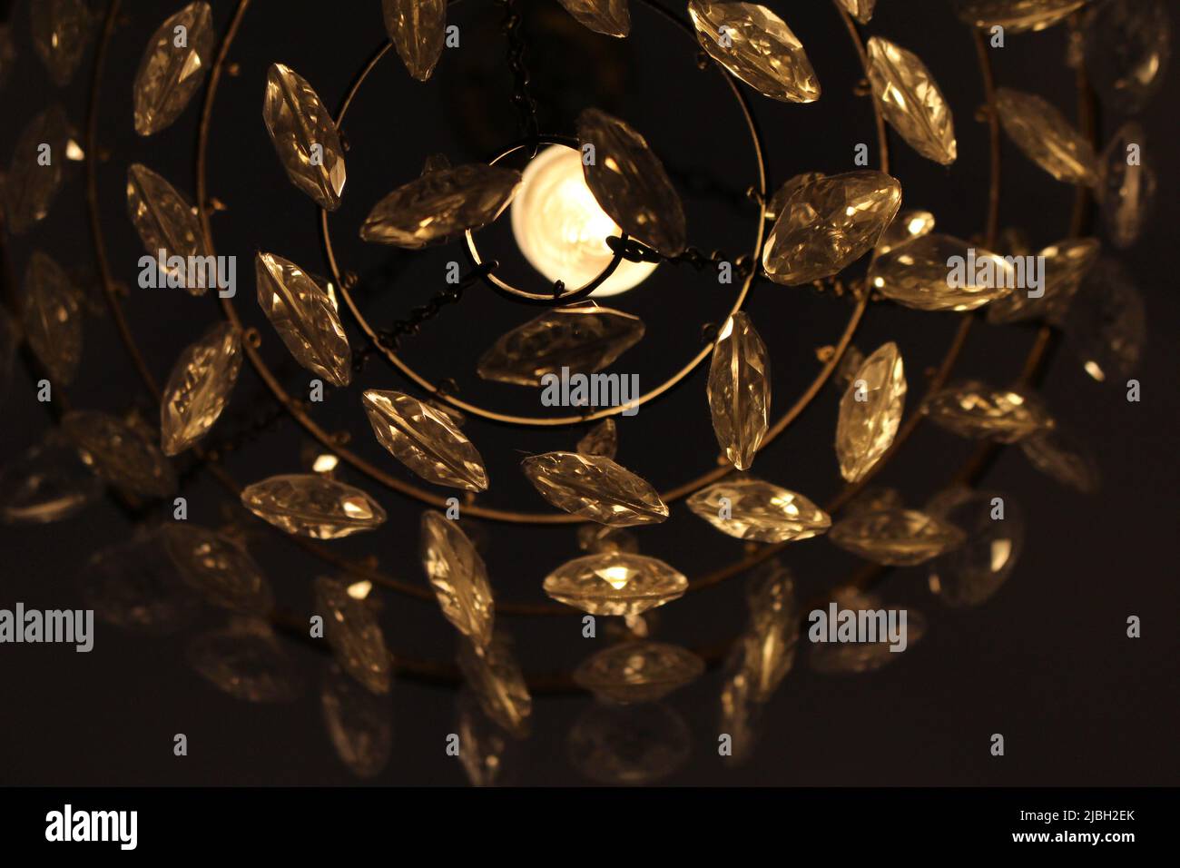 chandelier light from below with hanging glass Stock Photo - Alamy