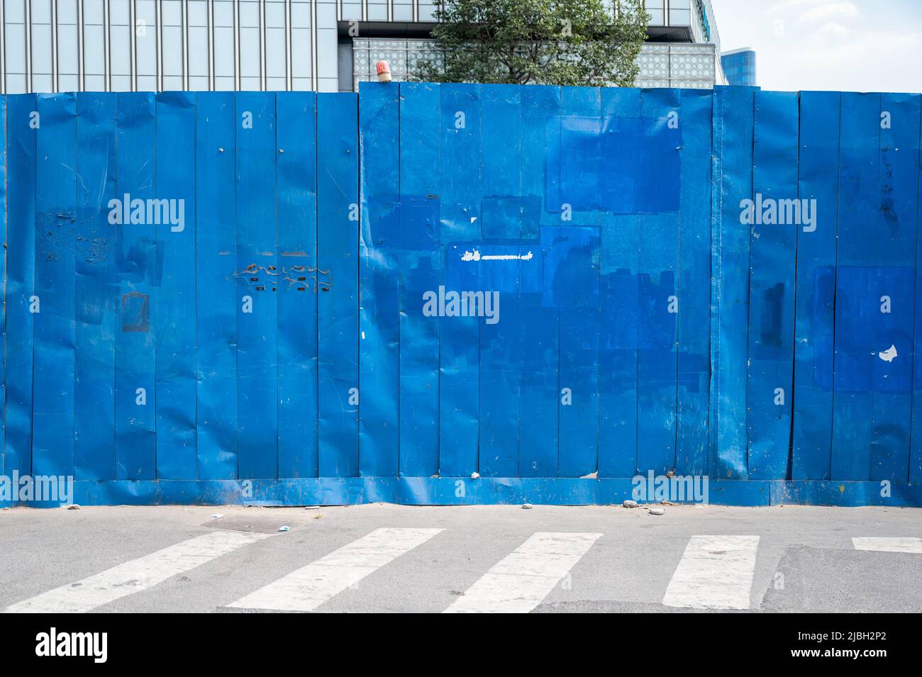 Blue container fence for construction safety zone Stock Photo - Alamy