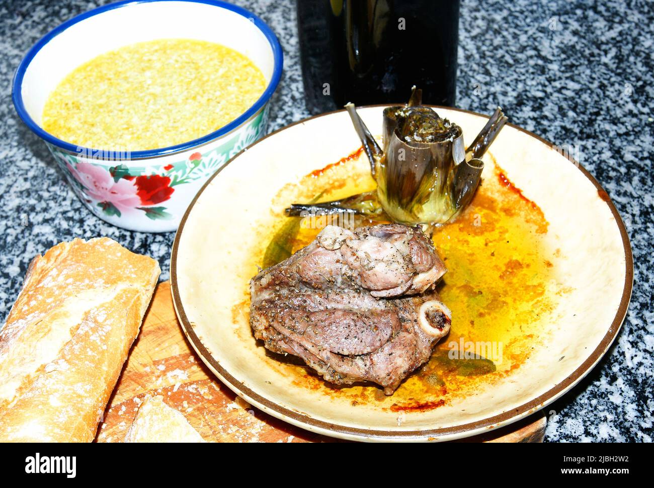 Baked Artichoke Pork Chop Combo Plate Stock Photo - Alamy