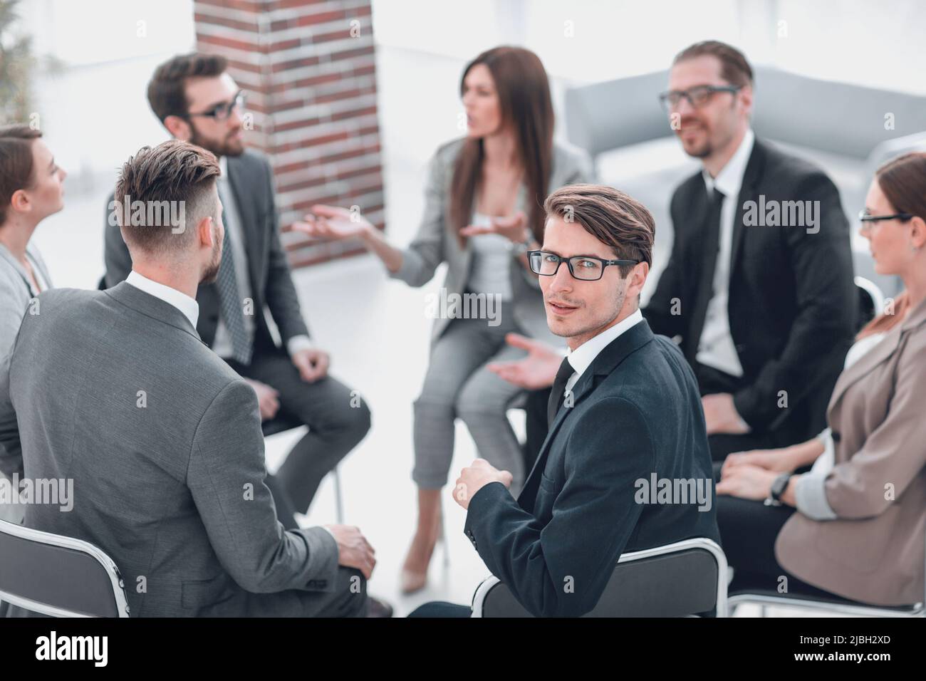young employee sitting at a seminar on team building.business concept ...