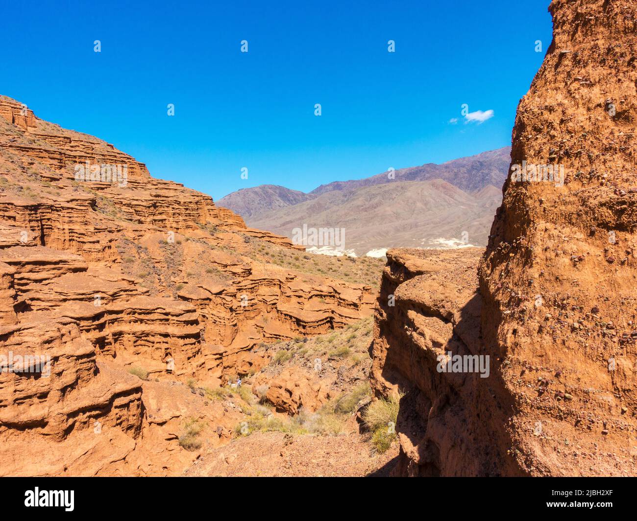 Red rocks and a passage between rocks. Clay canyons. Issyk-Kul region ...