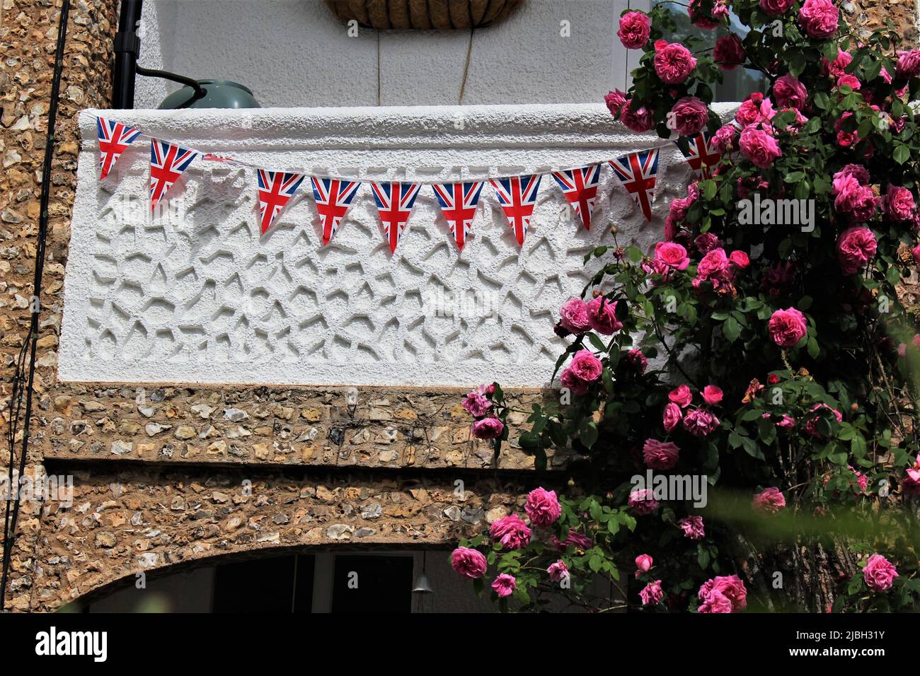 union jack banner and roses Stock Photo - Alamy
