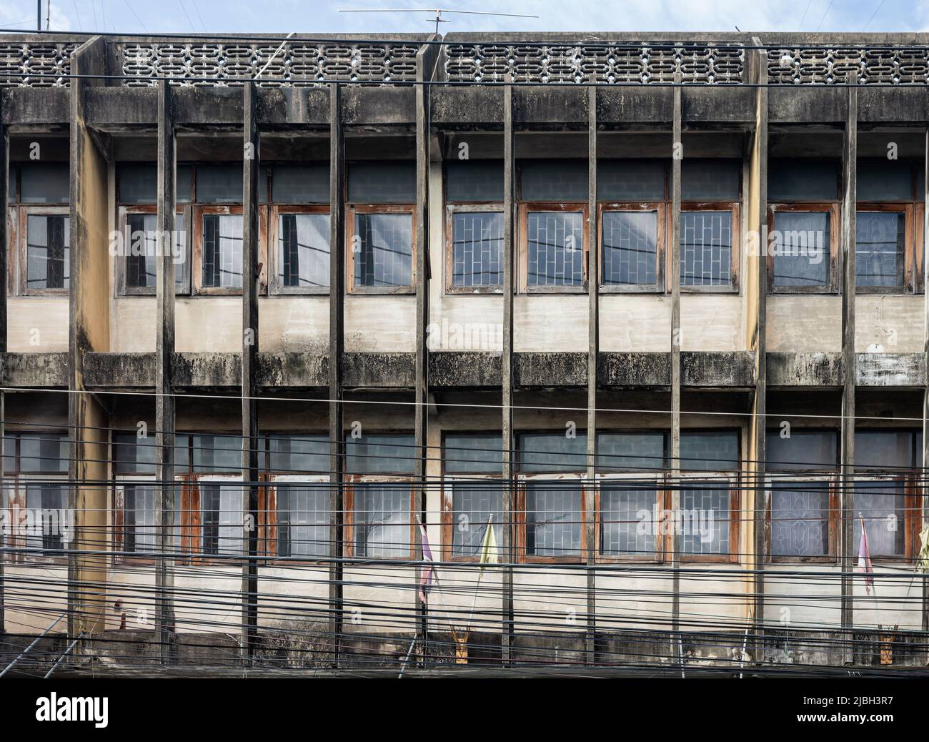Exterior row aged commercial building with window in suburban town ...
