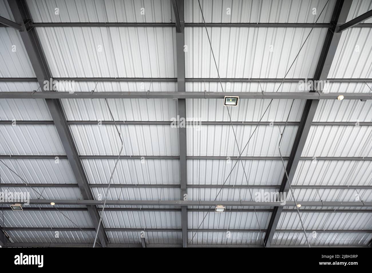 Interior of steel structure with roof ceiling in warehouse factory ...