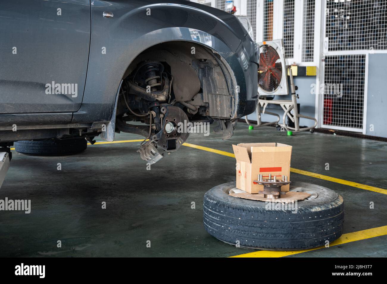 Repair and change parts a pickup truck with damaged axle and wheel ...