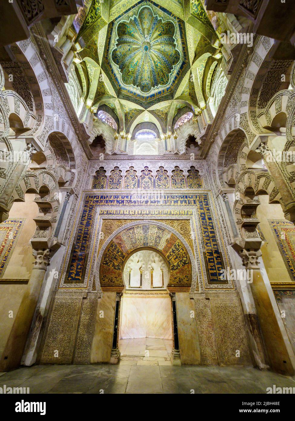The mosaic-decorated mihrab (center) and the interlacing arches of the ...