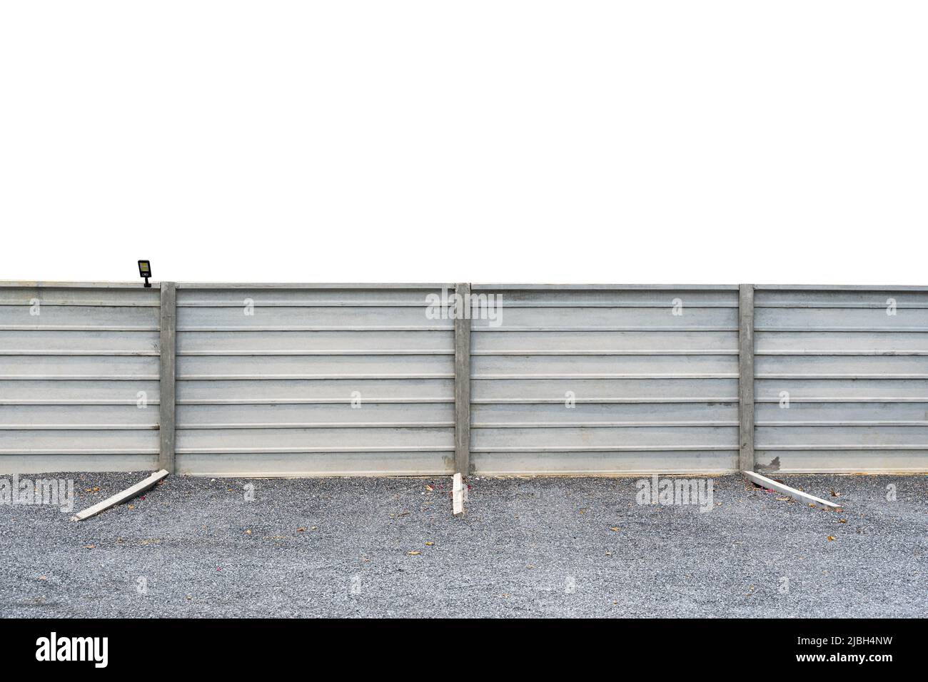 Cement wall with channel parking lot on gravel on white empty ...