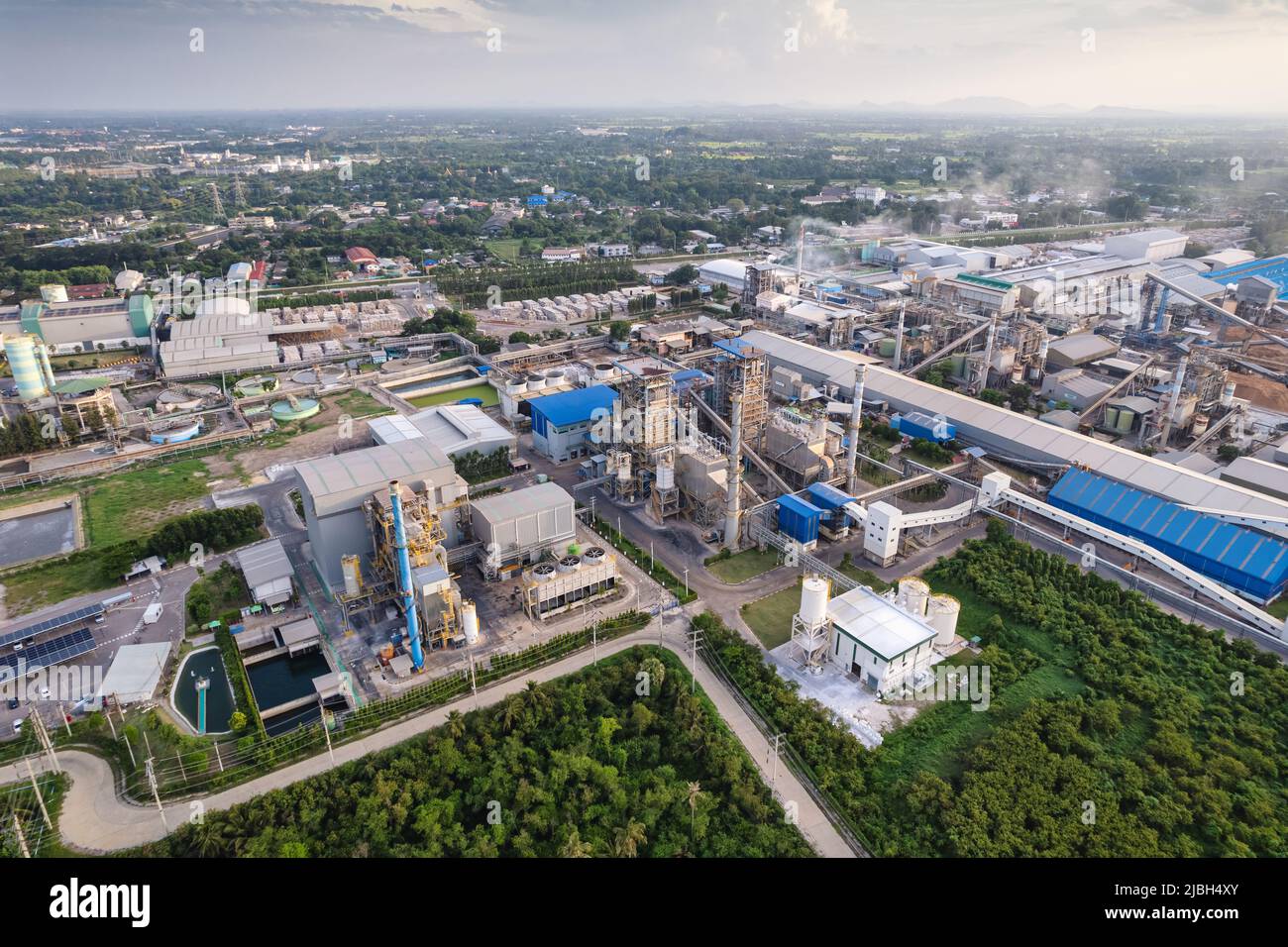 Aerial view of large green energy processing plant with building ...